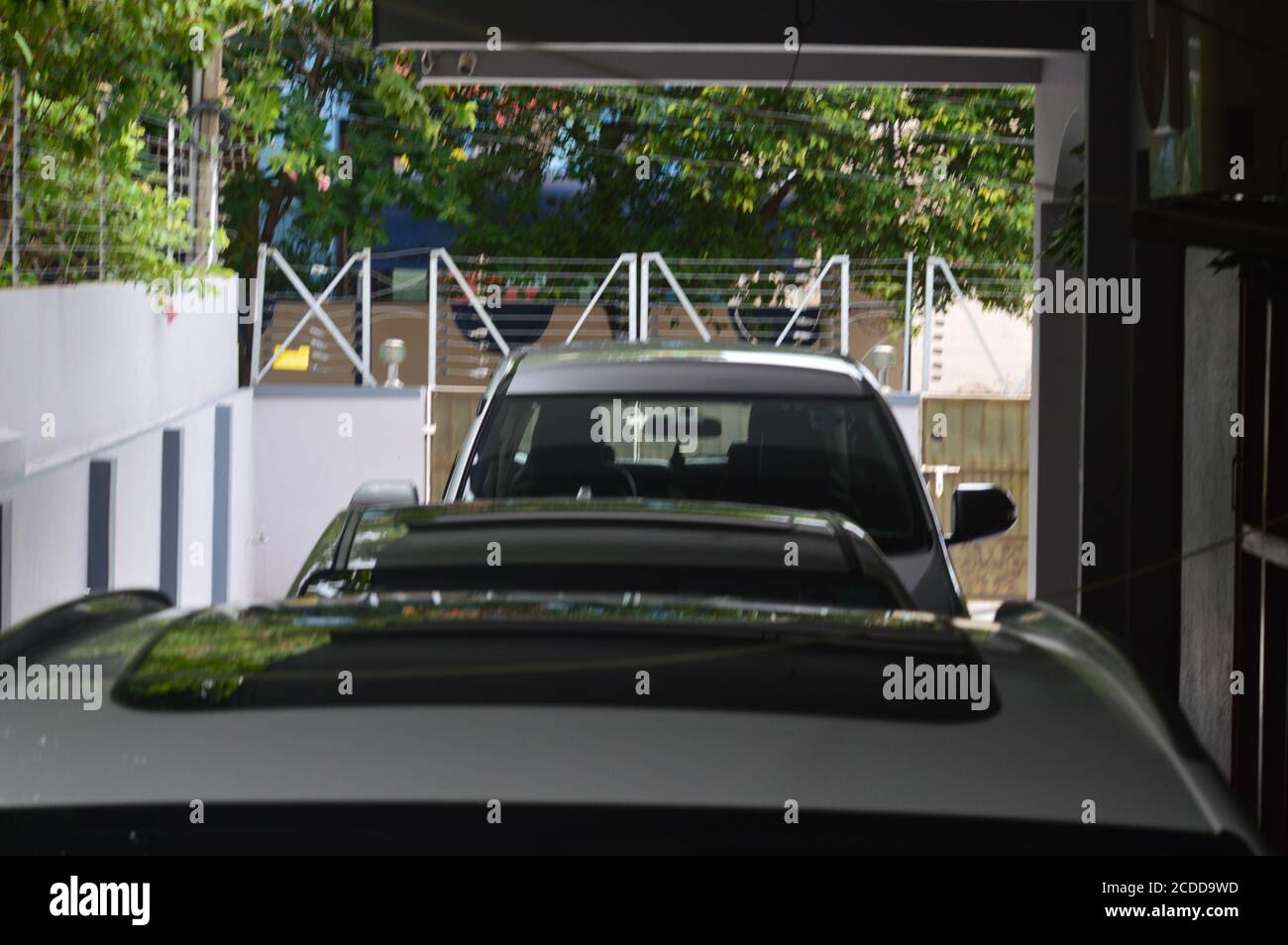 Luxury cars parked in a modern house in India Stock Photo - Alamy