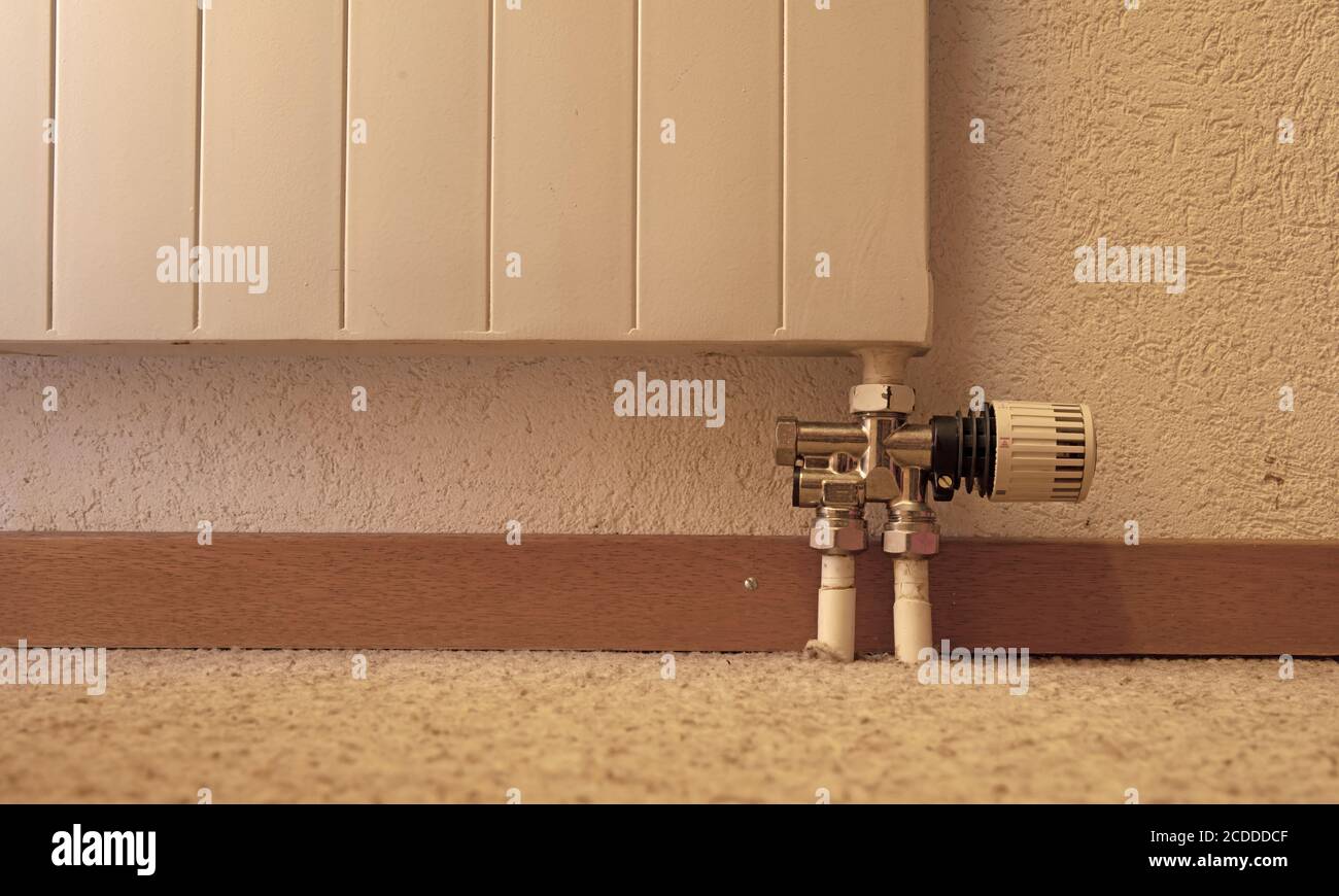 Heating radiator detail with adjusting knob, low to the ground Stock ...
