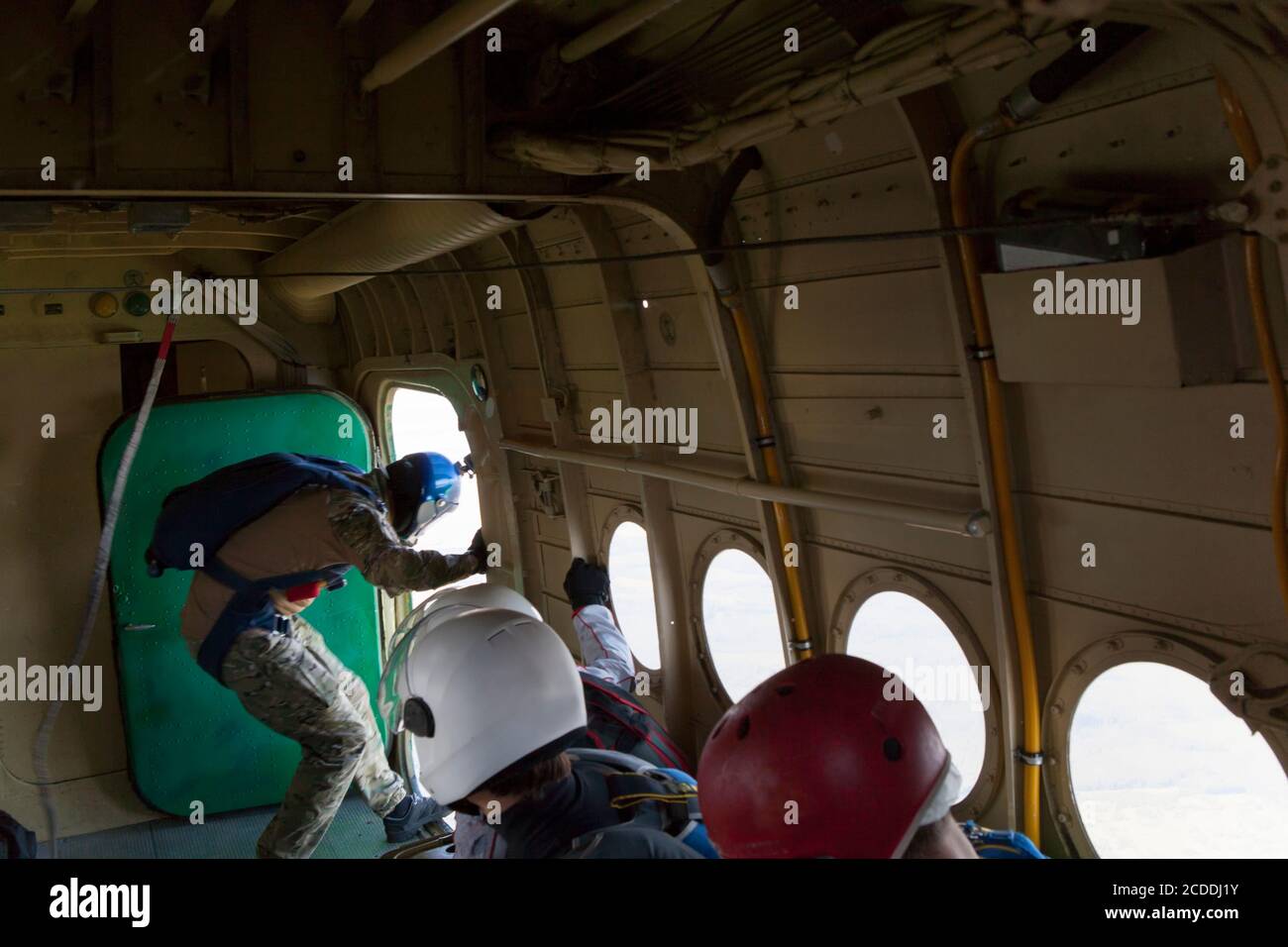 The parachutists jumping out of a plane, blurred motion shot Stock ...