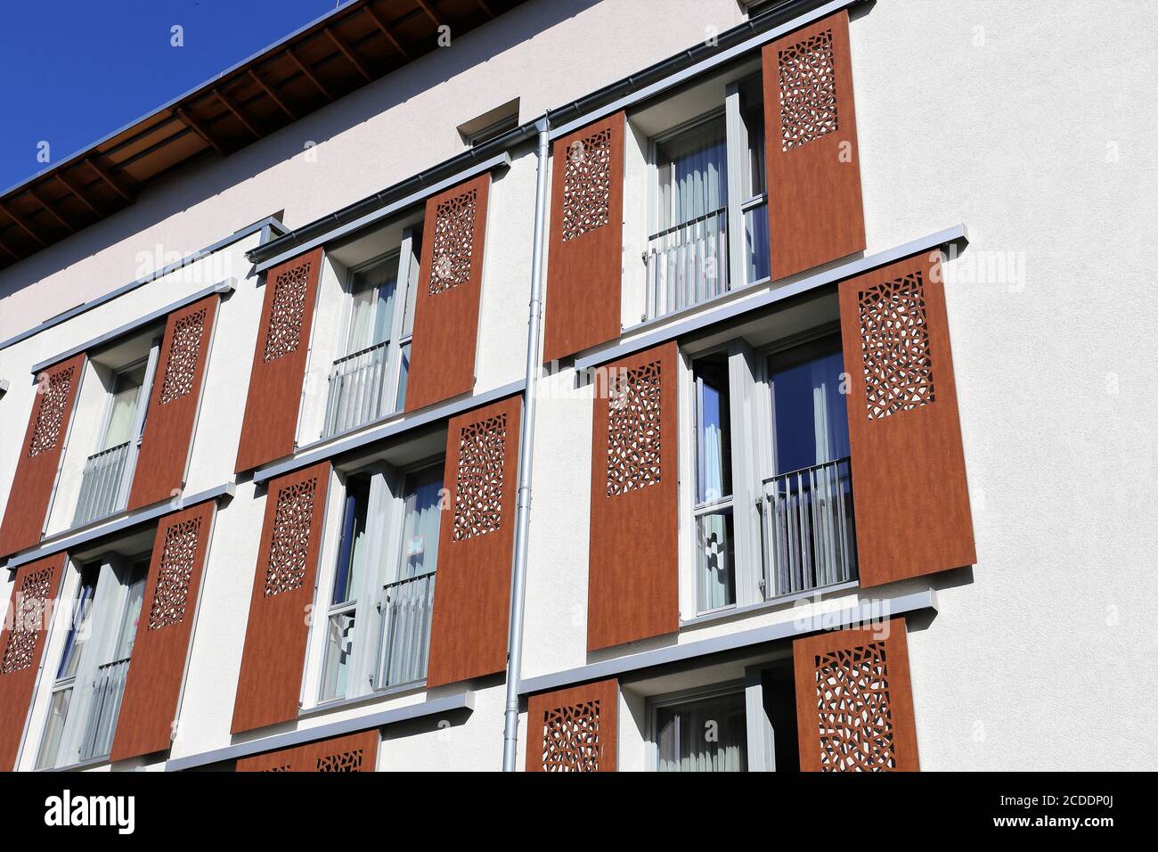 Windows with modern sliding shutters Stock Photo - Alamy