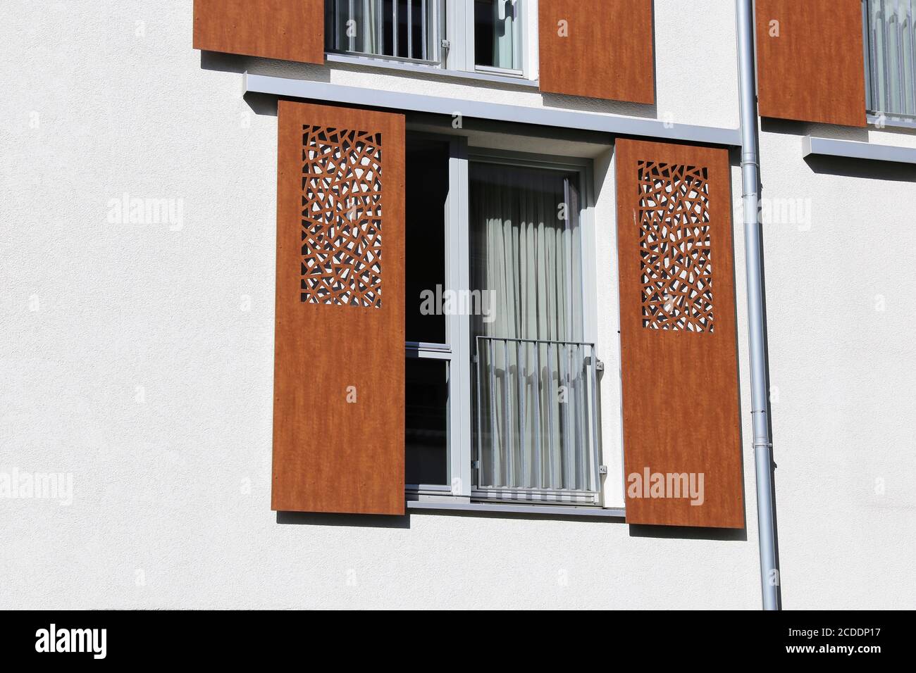 Windows with modern sliding shutters Stock Photo - Alamy