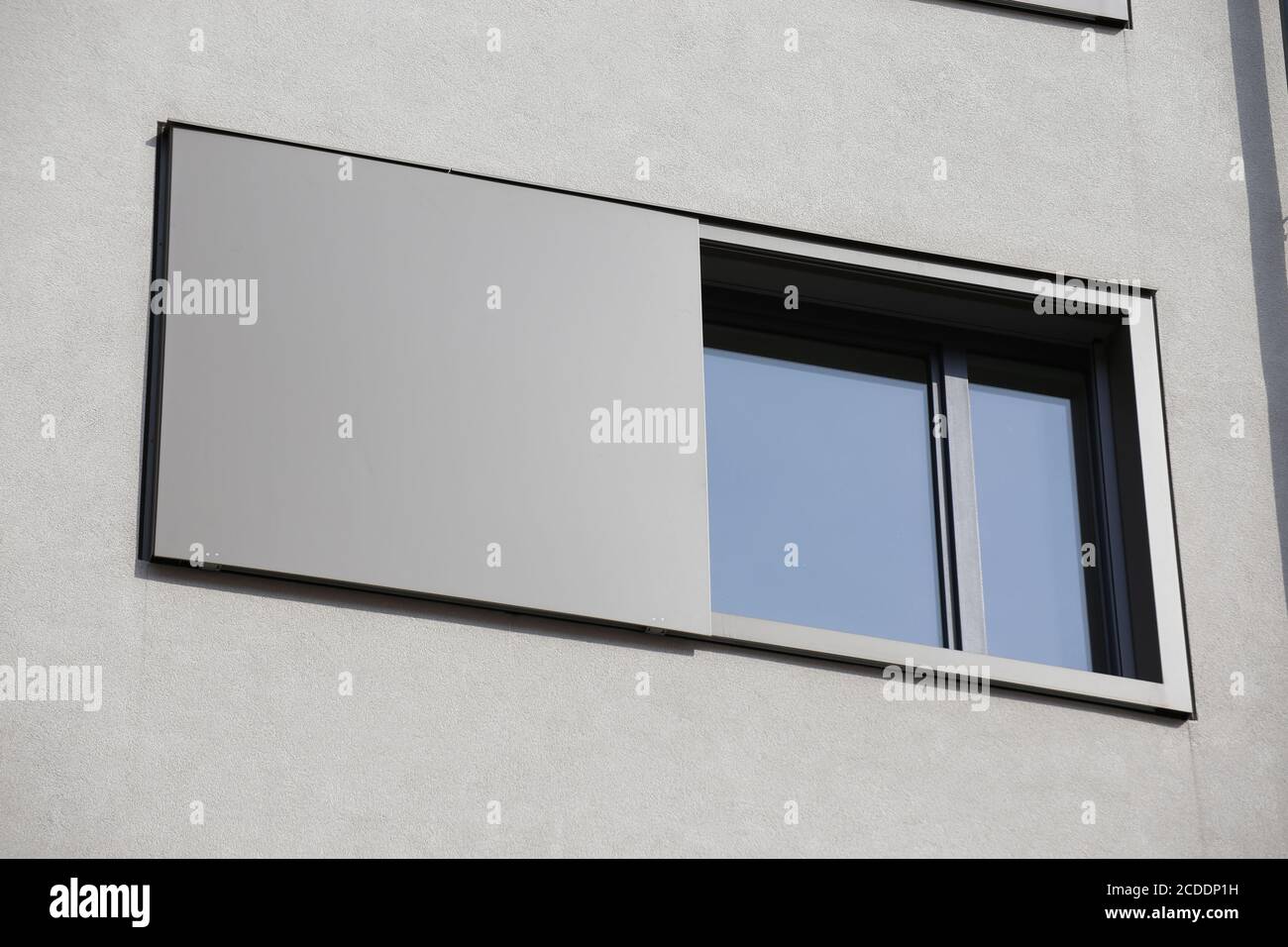 Windows with modern sliding shutters Stock Photo - Alamy