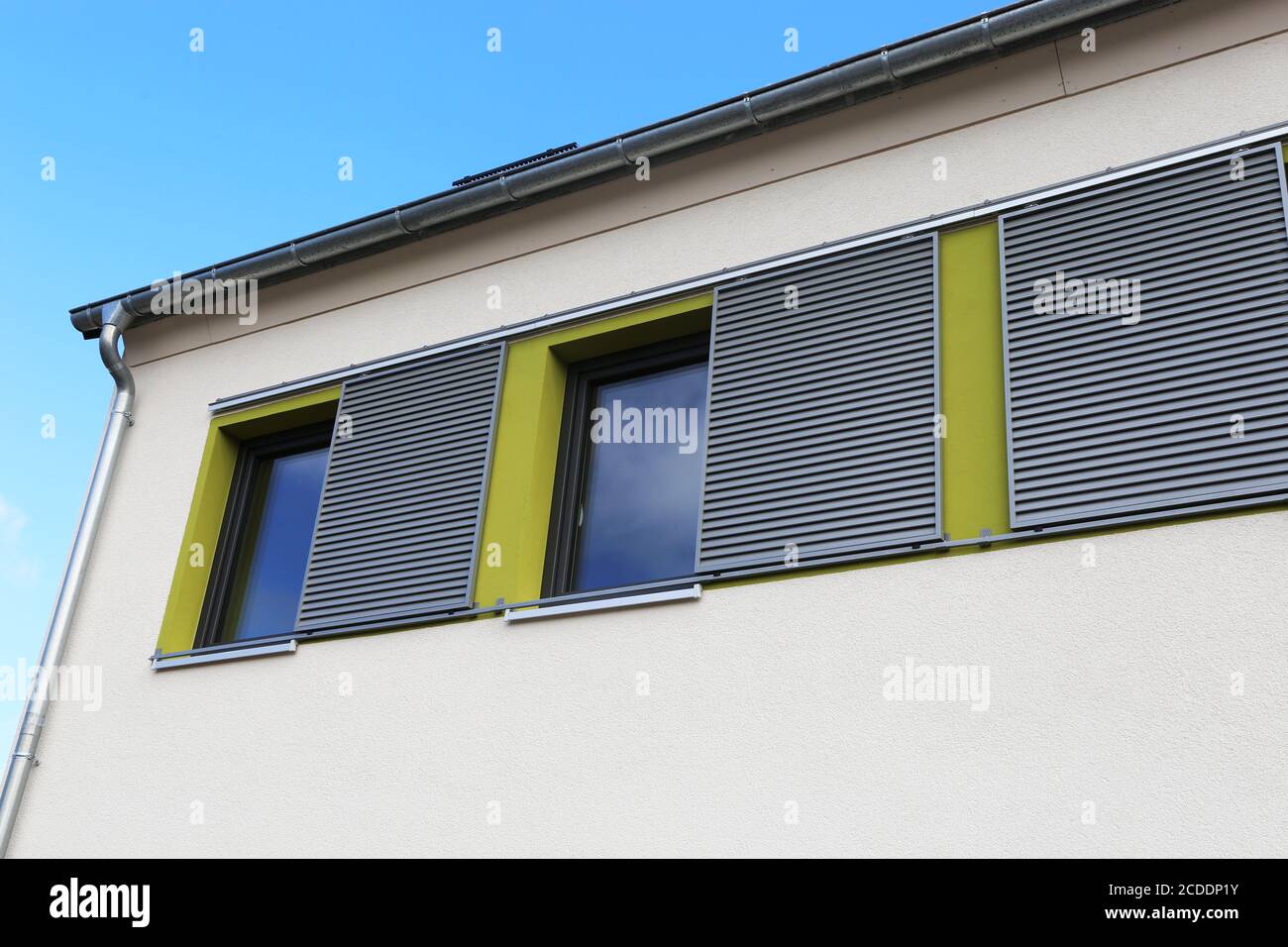 Windows with modern sliding shutters Stock Photo - Alamy