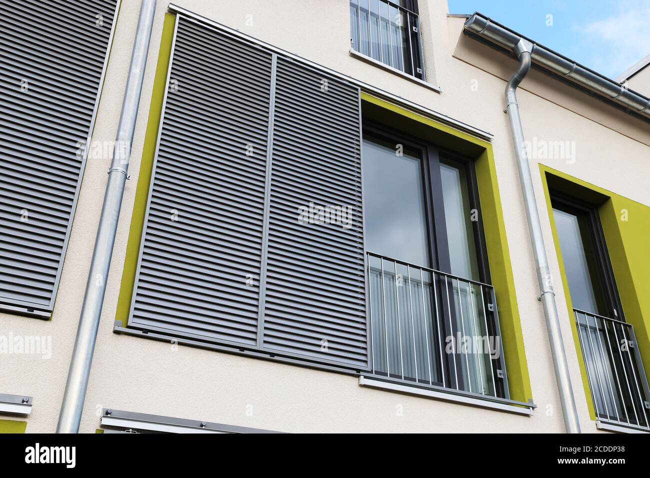 Windows with modern sliding shutters Stock Photo - Alamy