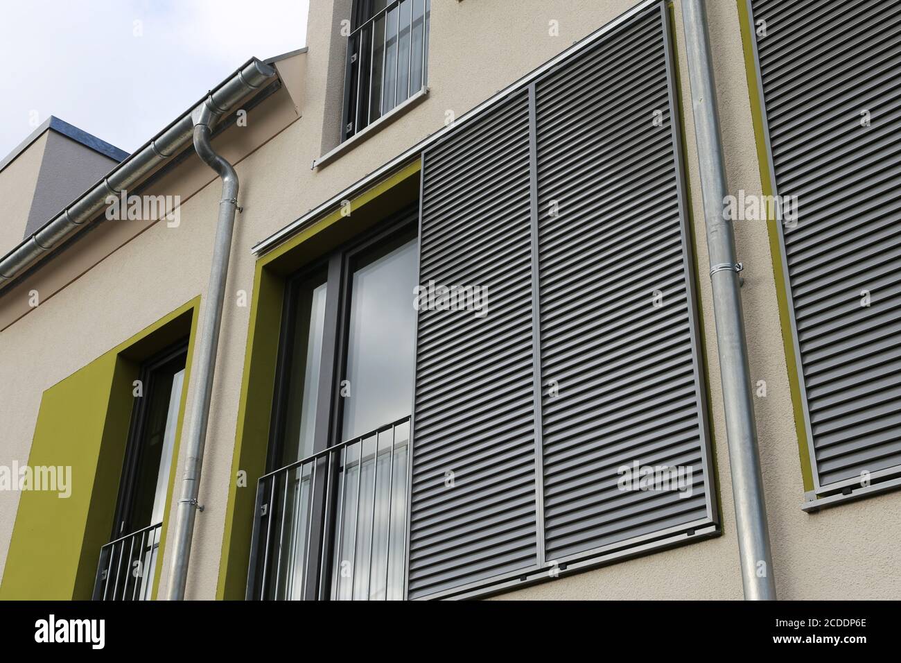 Windows with modern sliding shutters Stock Photo - Alamy