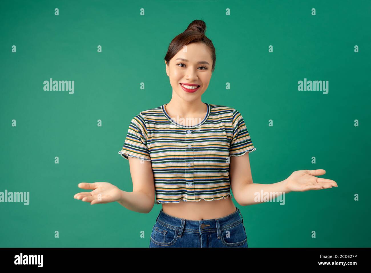 Beautiful Asian woman making a scale with her arms wide open, isolated ...