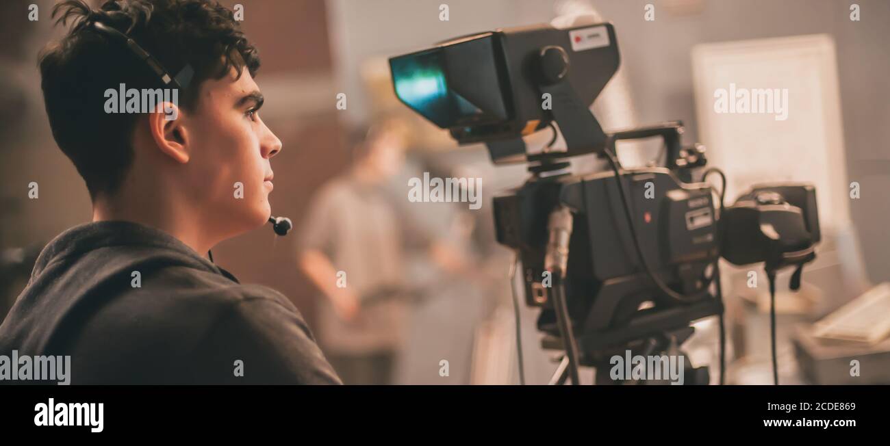 Behind the scene. Cameraman shooting the film scene with his camera in ...