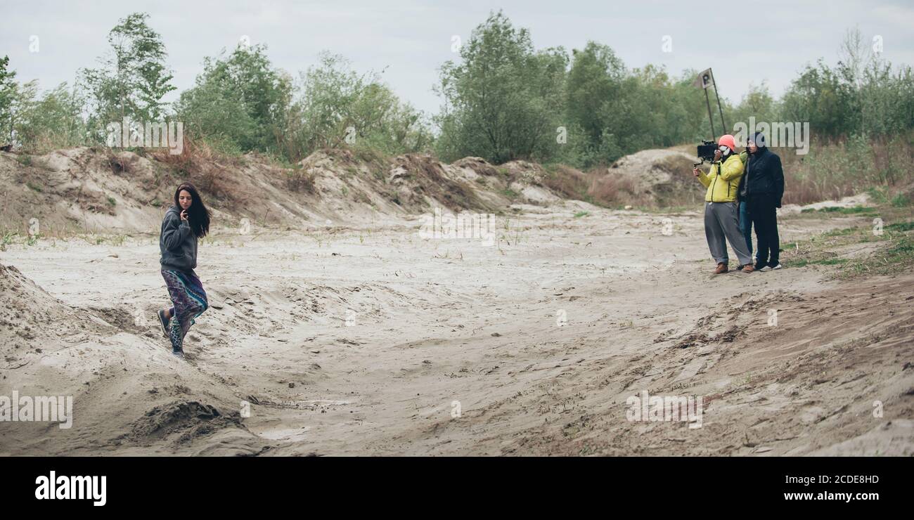 Behind the scene. Actress in front of the camera on the film set ...