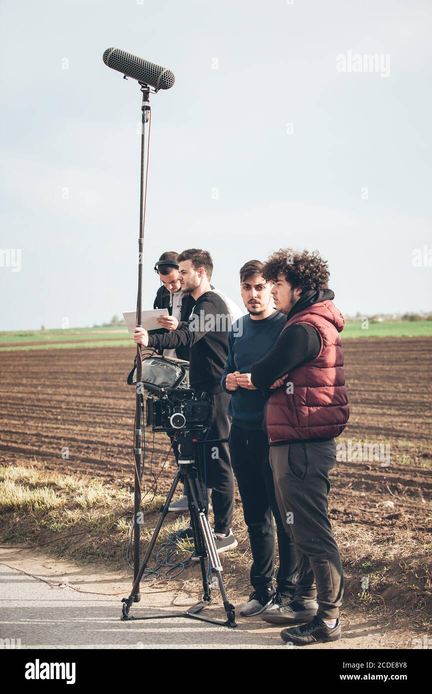 Behind the scene. Film crew team filming movie scene on outdoor ...