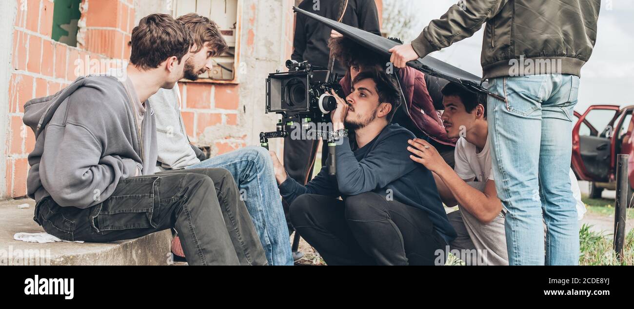 Behind the scene. Film crew team filming movie scene on outdoor ...