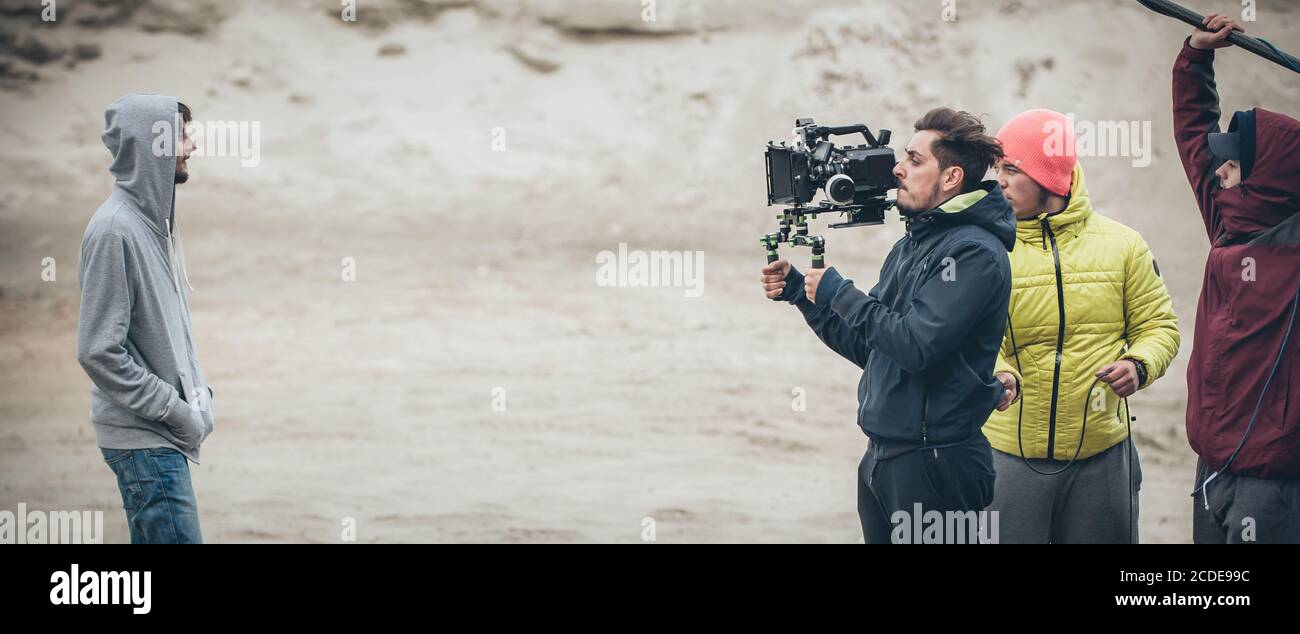 Behind the scene. Film crew team filming movie scene on outdoor ...