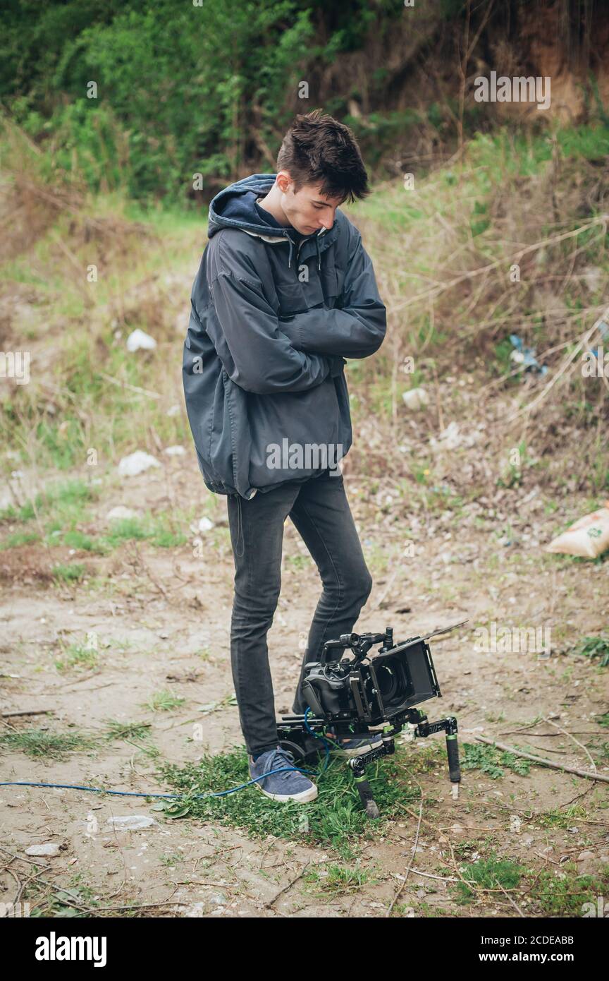 Behind the scene. Cameraman shooting the film scene with his camera on ...