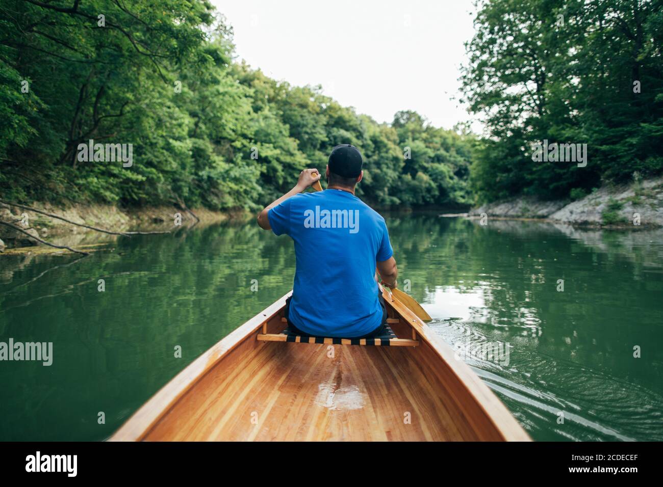 Man paddling wooden canoe hi-res stock photography and images - Alamy