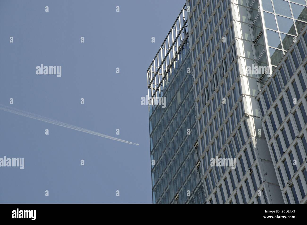 Aircraft and high-rise building Stock Photo - Alamy