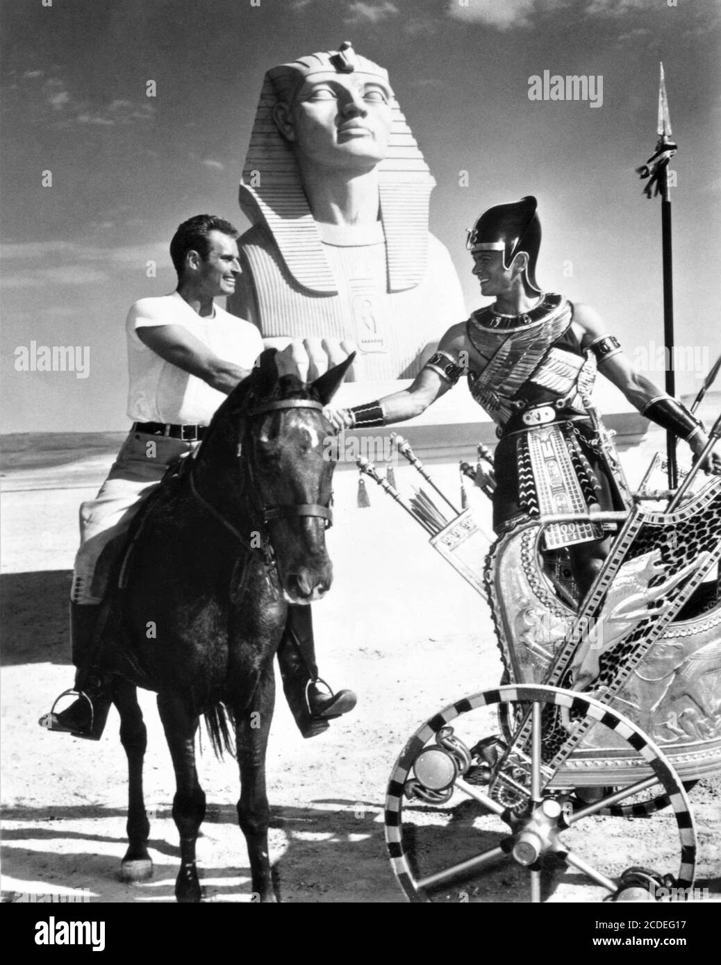 CHARLTON HESTON on horseback and YUL BRYNNER in chariot on set location ...