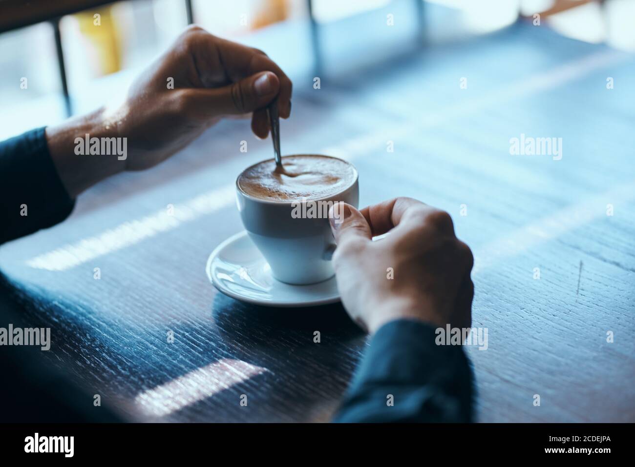 cafe restaurant table male hands coffee cup model Stock Photo - Alamy