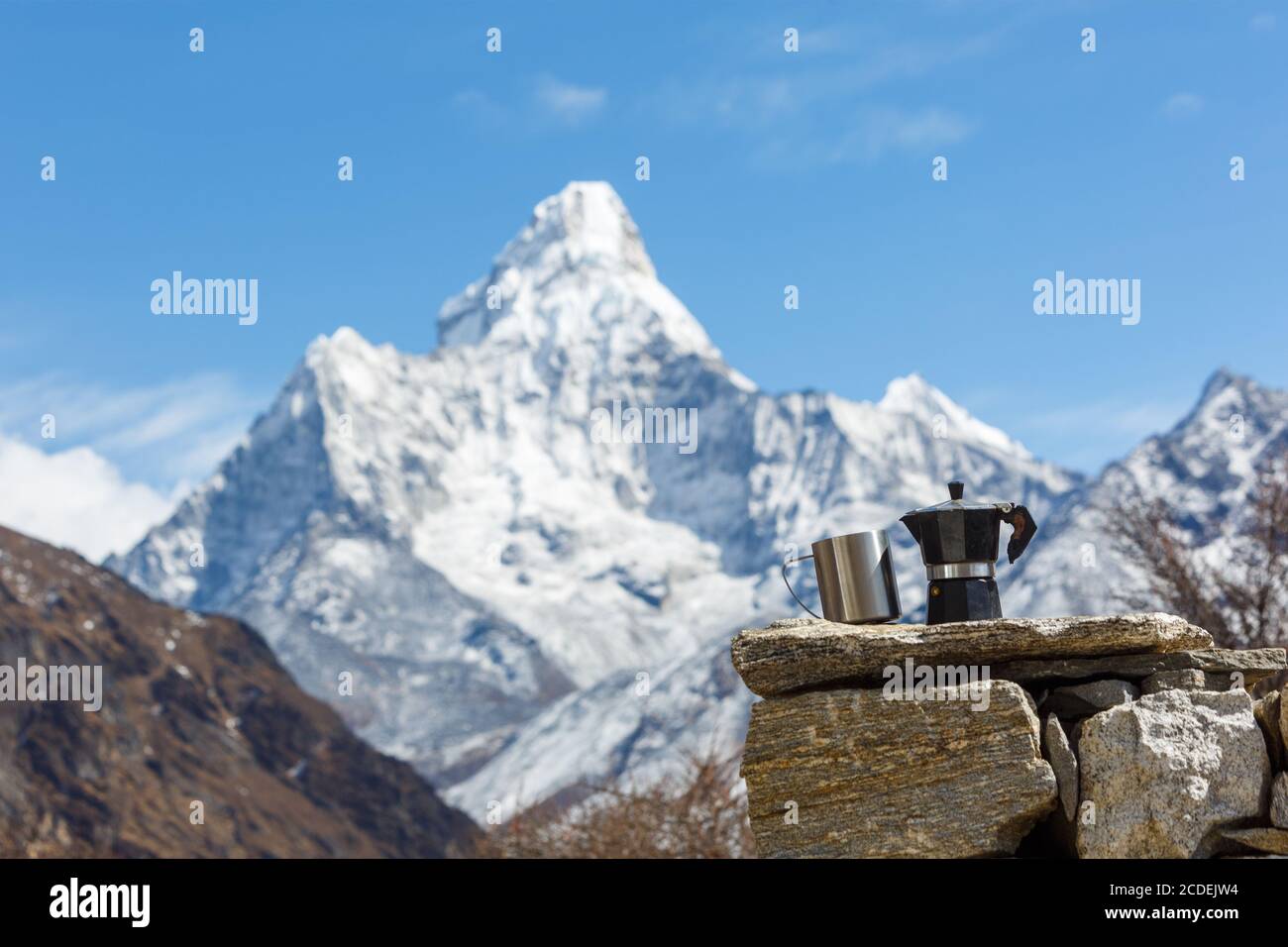 Everest Base Camp trek. Vintage coffee maker with a mug in focus. The ...