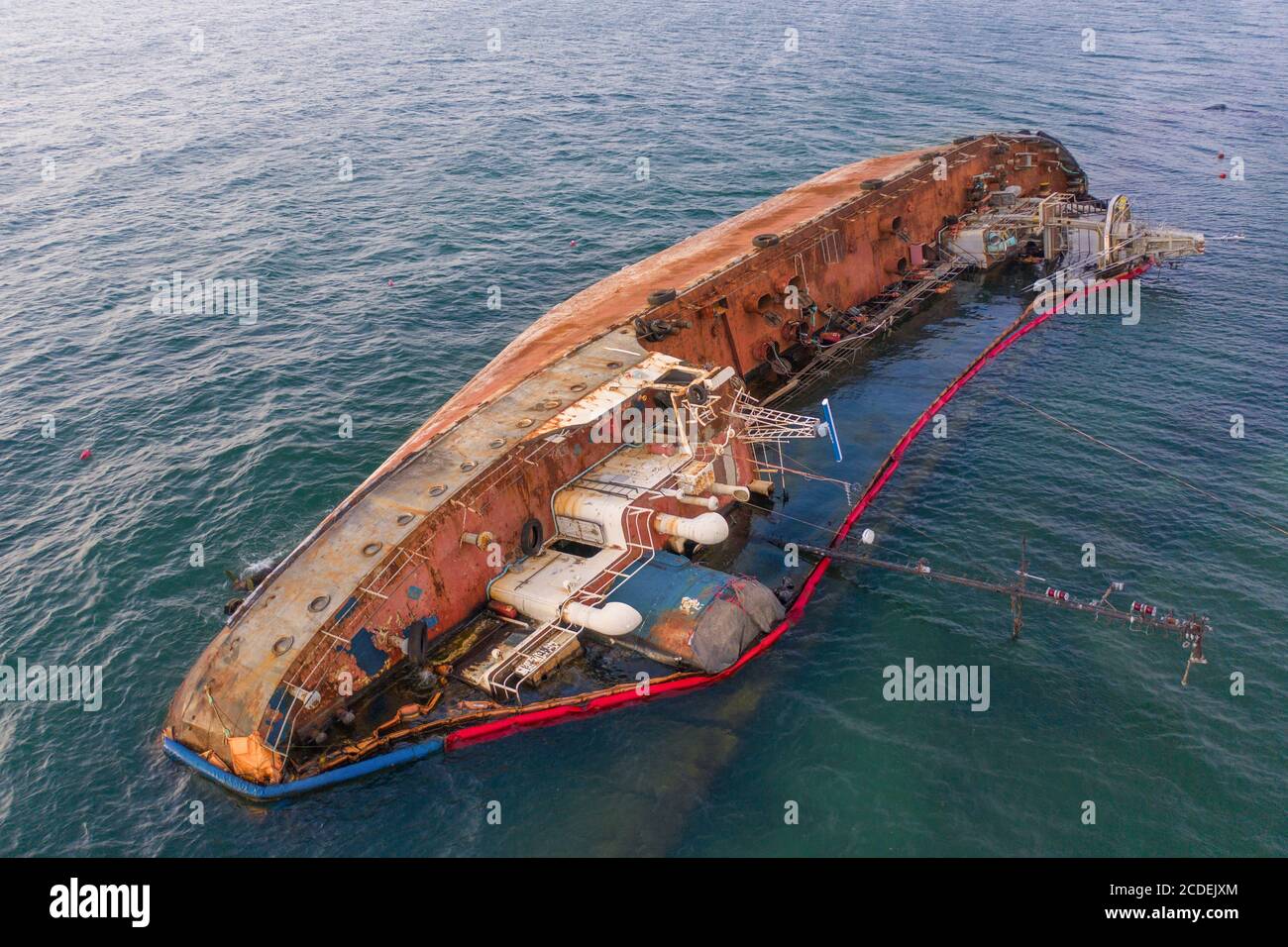 Tanker after the accident, overturned in the water Stock Photo - Alamy