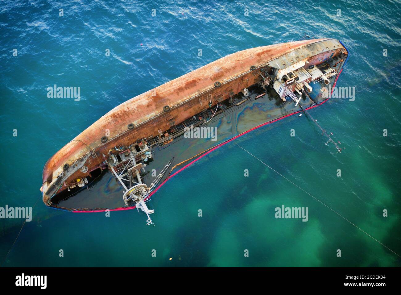 Tanker after the accident, overturned in the water Stock Photo - Alamy