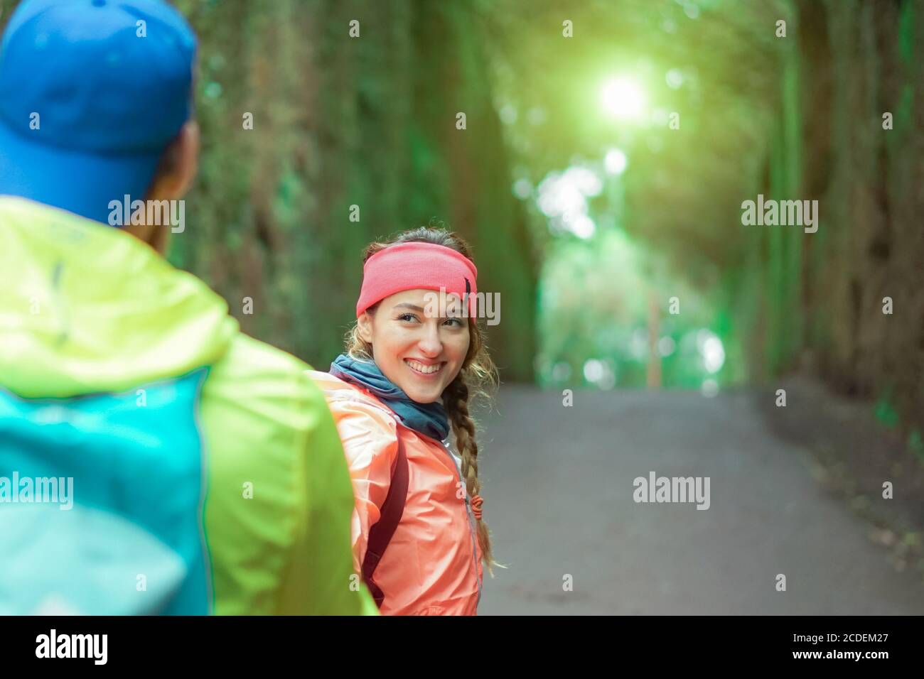 Happy trekkers in a mountain path. Girl face having fun on hiking day ...