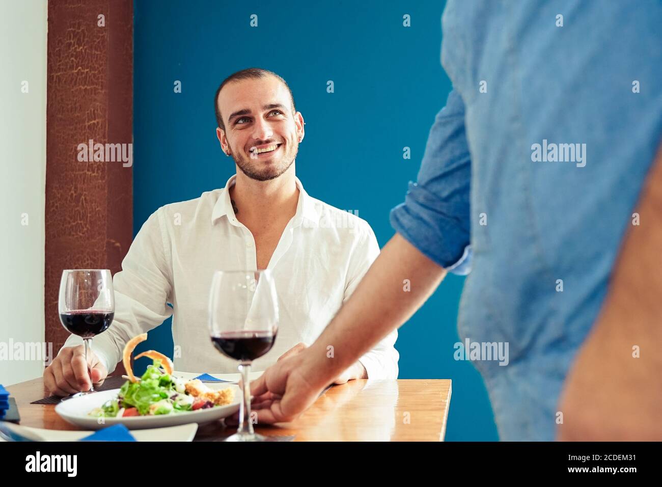 Hand Presenting Food Plate High Resolution Stock Photography and Images ...