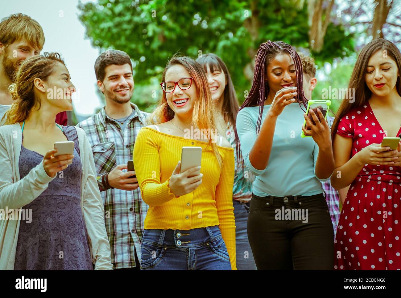 Happy friends using smartphones - Young students people having fun with ...