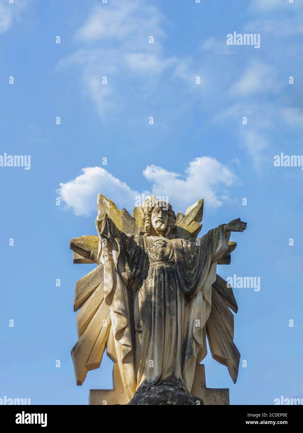 Vertical shot of sculpture of Jesus Christ without a right hand on a ...