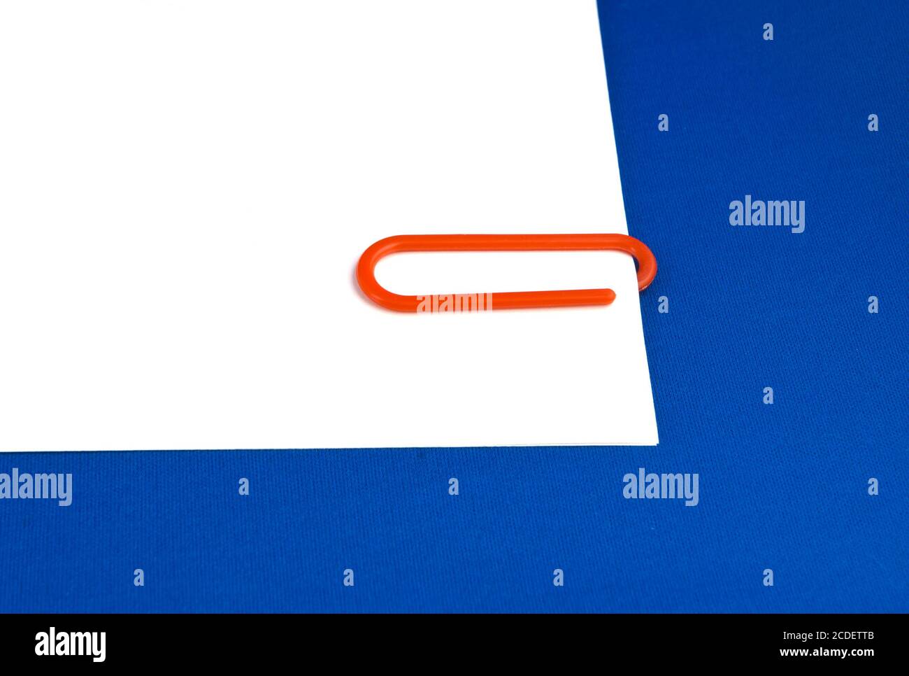 White paper whit paperclip Stock Photo - Alamy