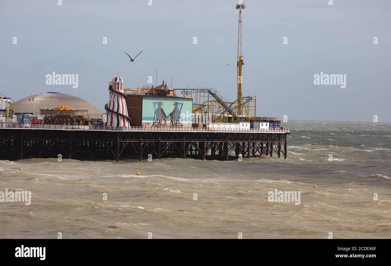 Brighton pier surrounded by Rough seas in Brighton, East Sussex, UK ...