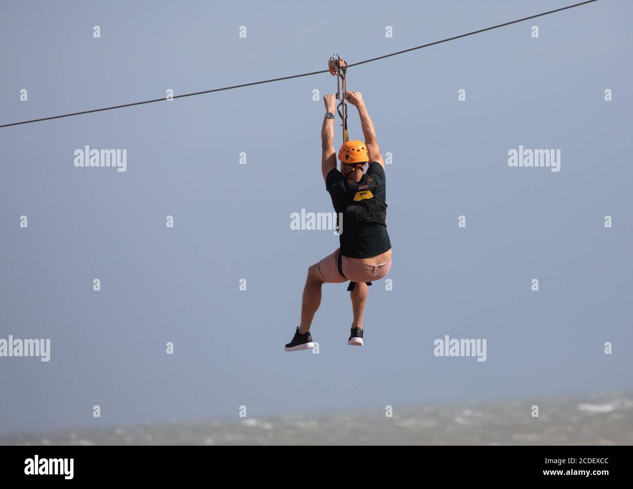 People ride The Zip Wire in Brighton, East Sussex, UK Stock Photo - Alamy