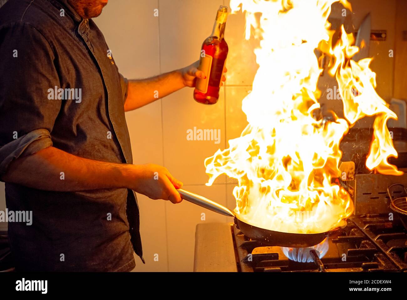 The process of cooking alcohol on a grill. The concept of cooking a ...