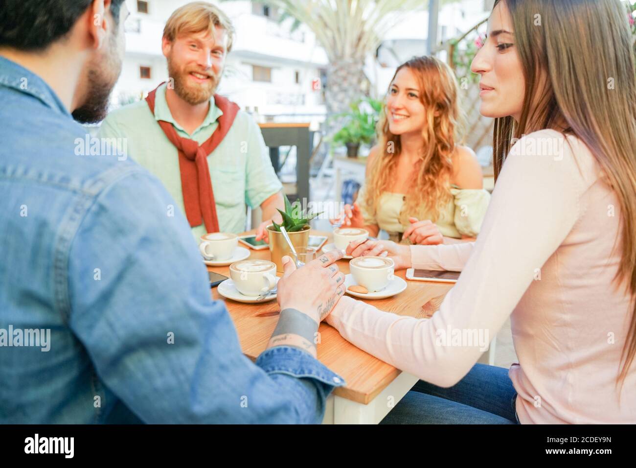 Couples doing breakfast in a bar coffeehouse. Lovers at a romantic date ...