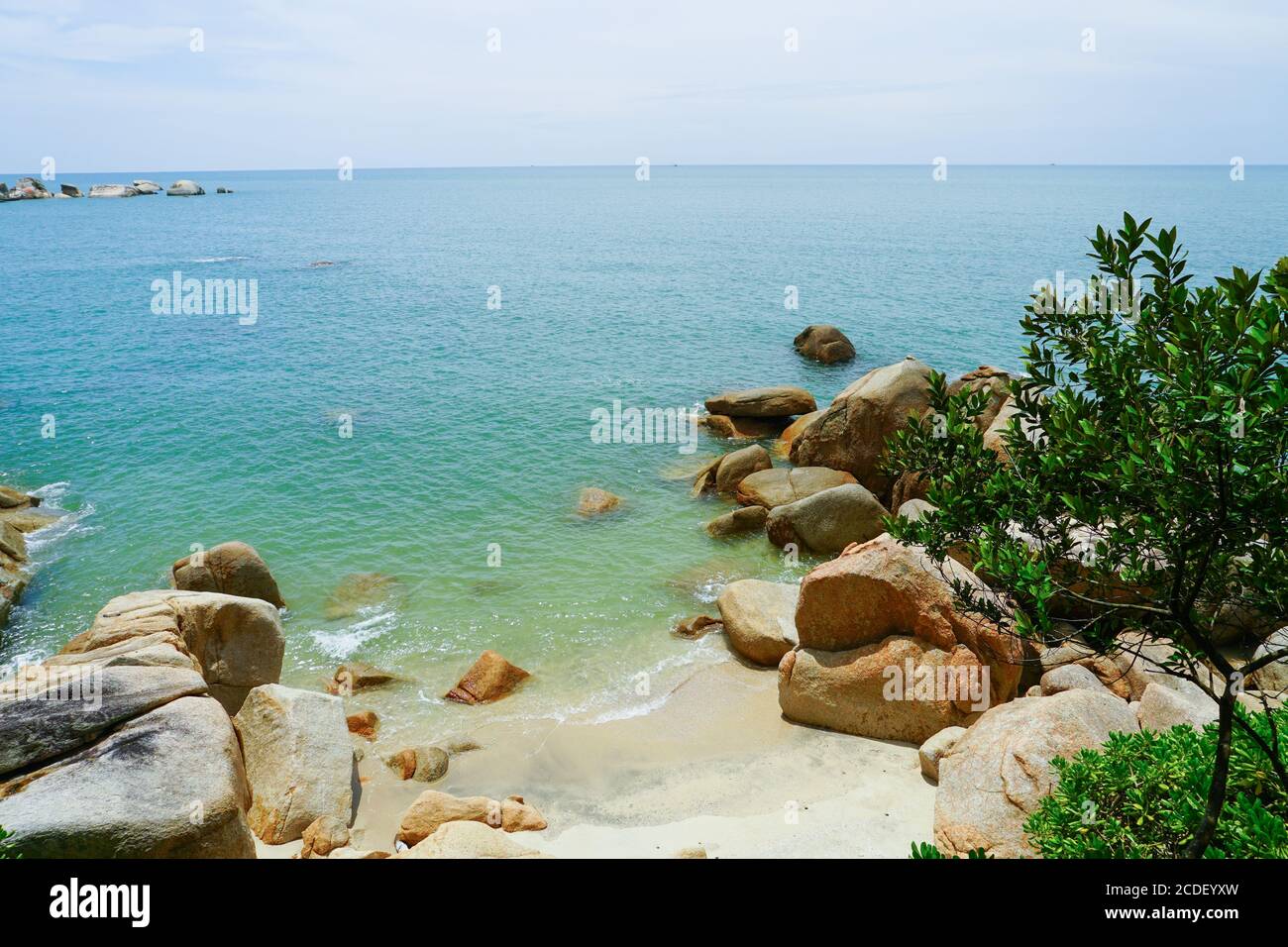 Tropical beach and blue sky background ona Rocky beach landscape on ...