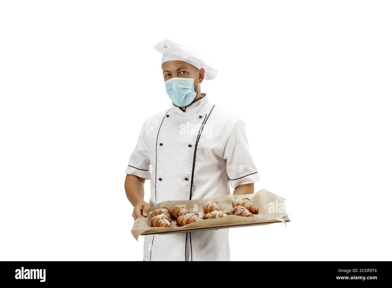 Cooker, chef, baker in face mask in uniform on white background with ...