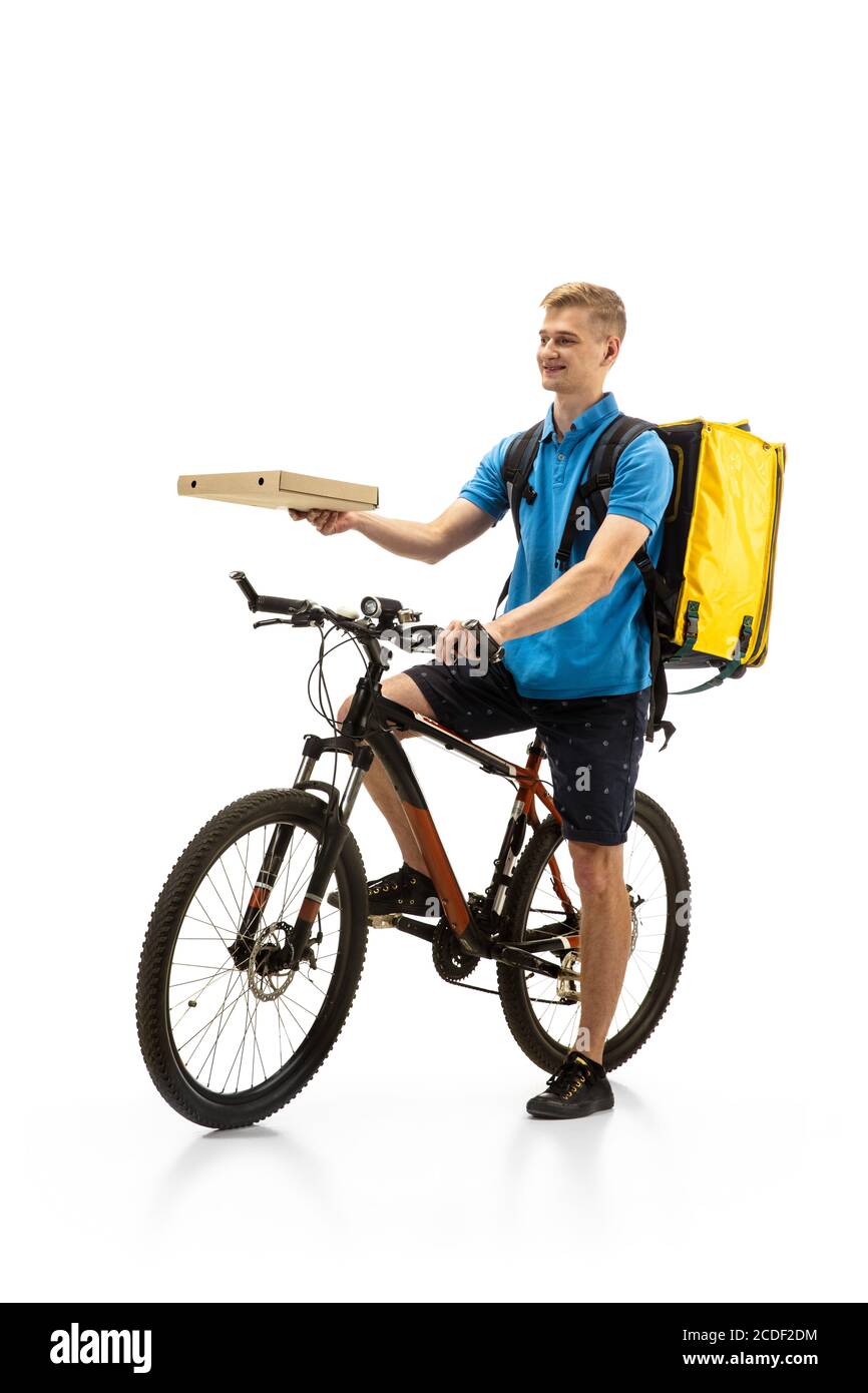 Giving pizza. Deliveryman with bicycle isolated on white studio ...