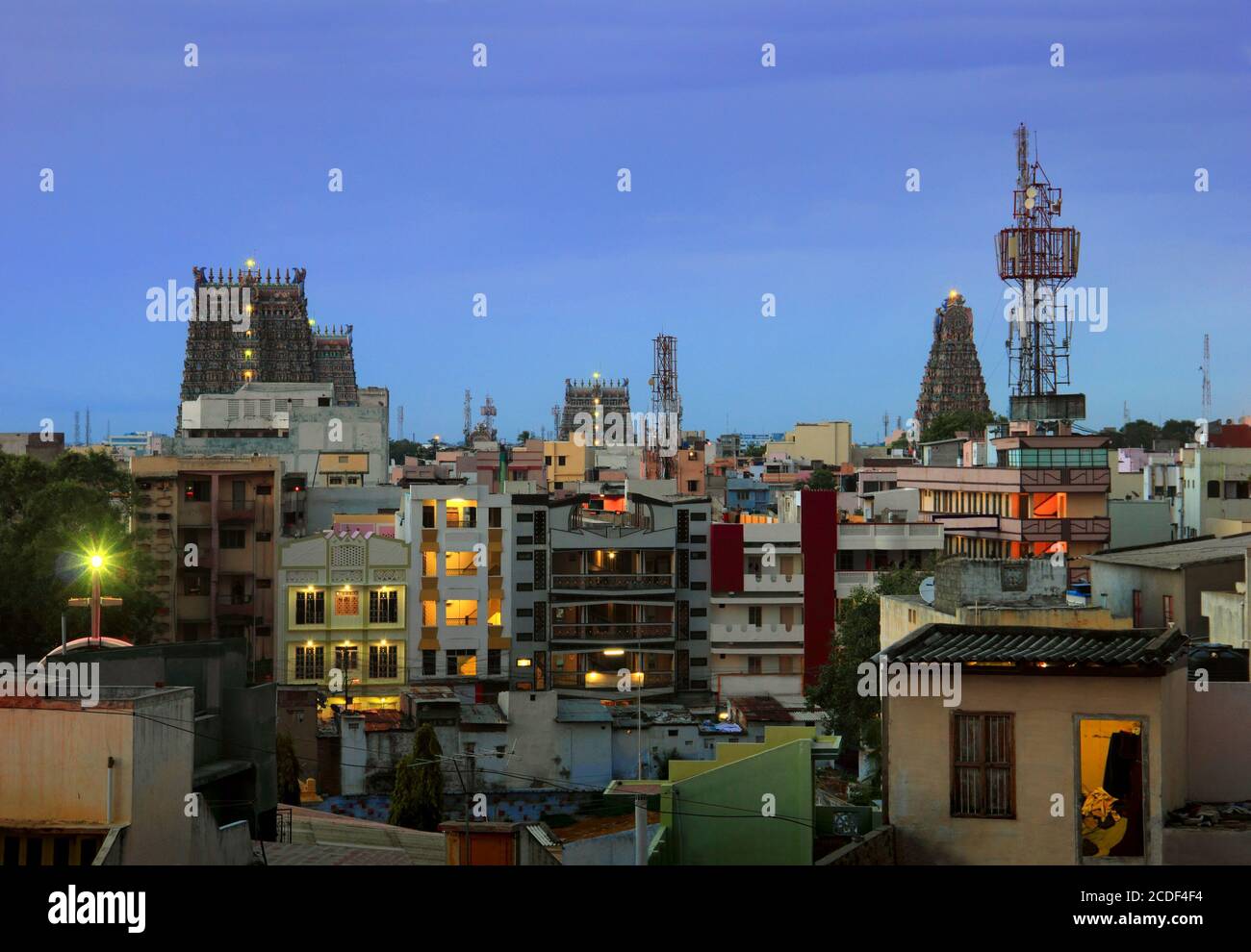 Night view of Madurai city with houses roofs and gopuras of ancient Sri ...
