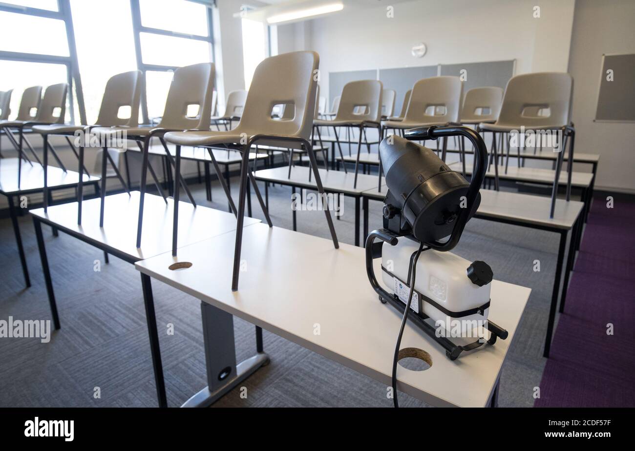 A fogging machine, which can disinfect a whole classroom, is set up in ...
