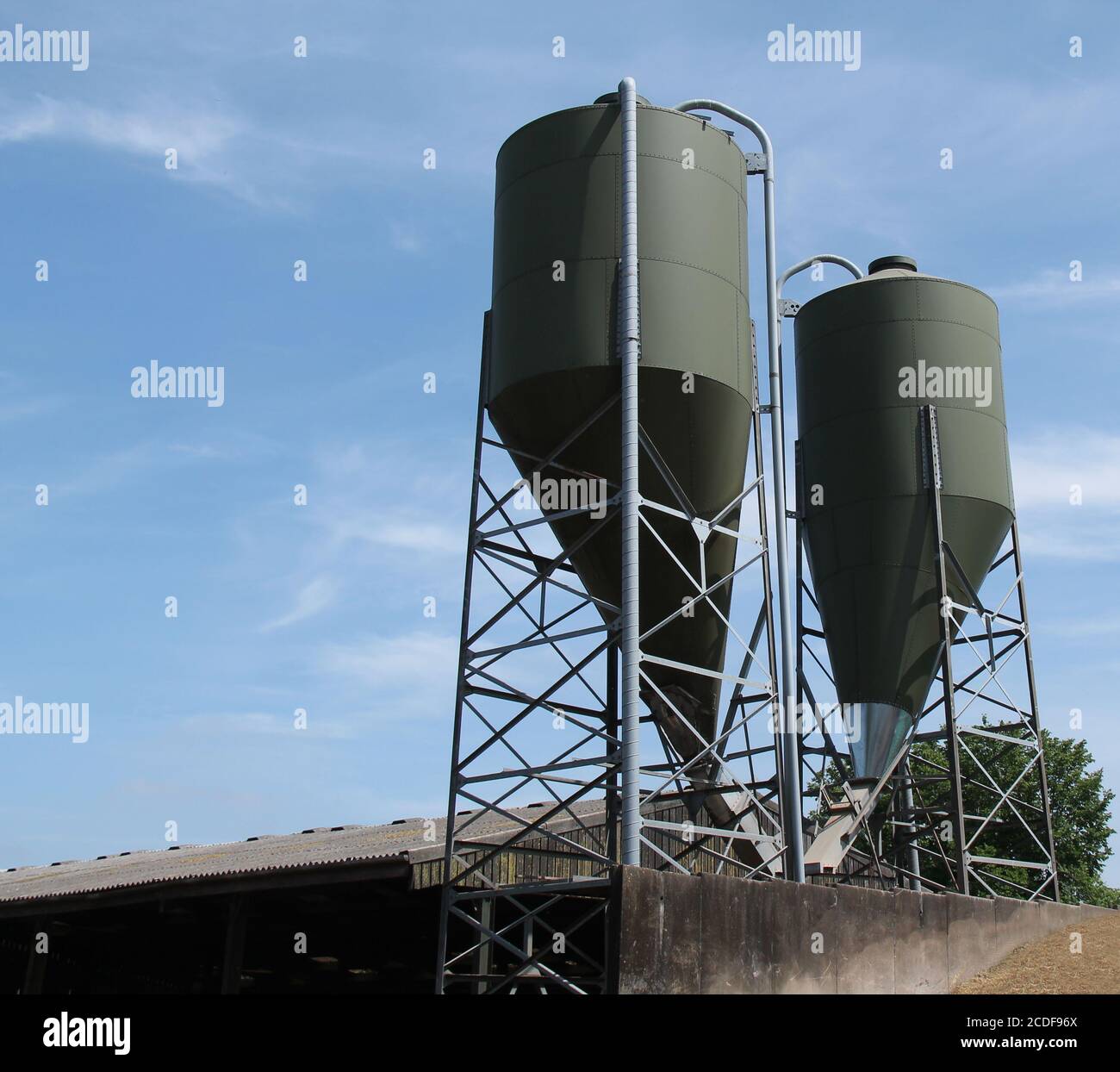 Two Vertical Agricultural Farm Feed Storage Hoppers Stock Photo - Alamy