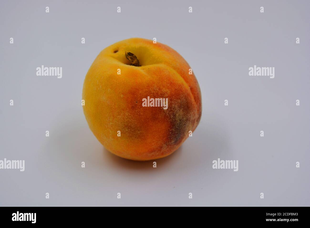 One large peach, large Ukrainian peach located on a white background ...