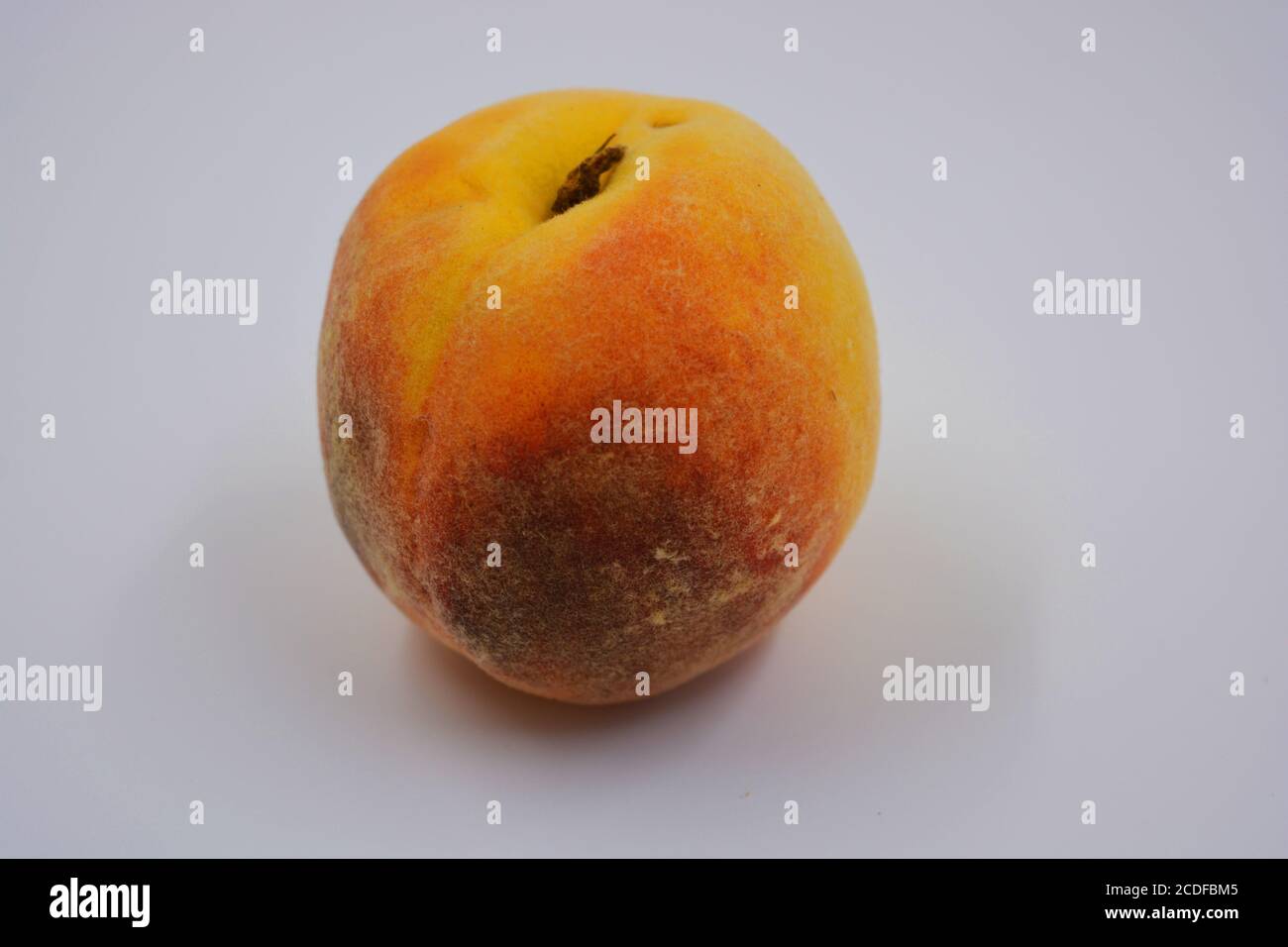 One large peach, large Ukrainian peach located on a white background ...