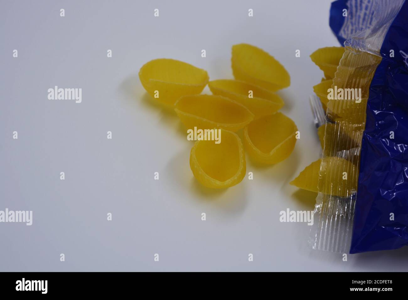 Italian yellow pasta made from durum wheat, vermicelli shells scattered ...