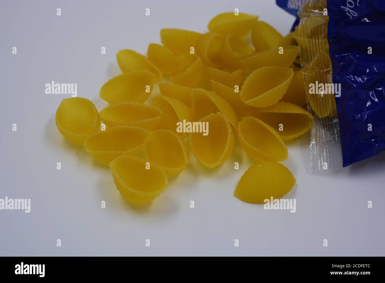 Italian yellow pasta made from durum wheat, vermicelli shells scattered ...