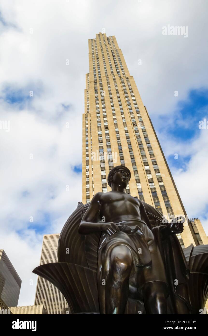 Statue in front of the tall skyscraper 30 Rockefeller Plaza at the ...