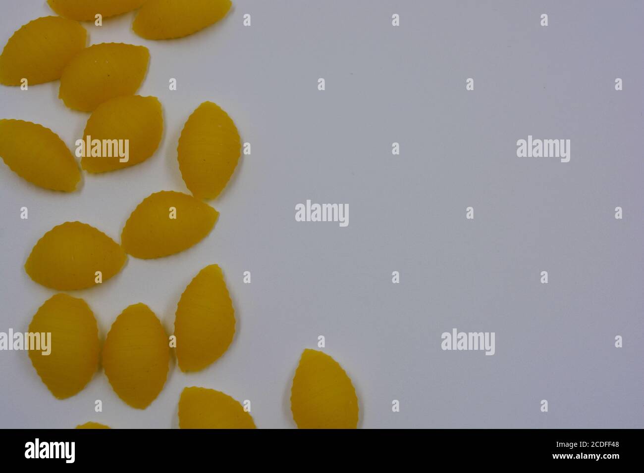 Italian yellow pasta made from durum wheat, vermicelli shells scattered ...