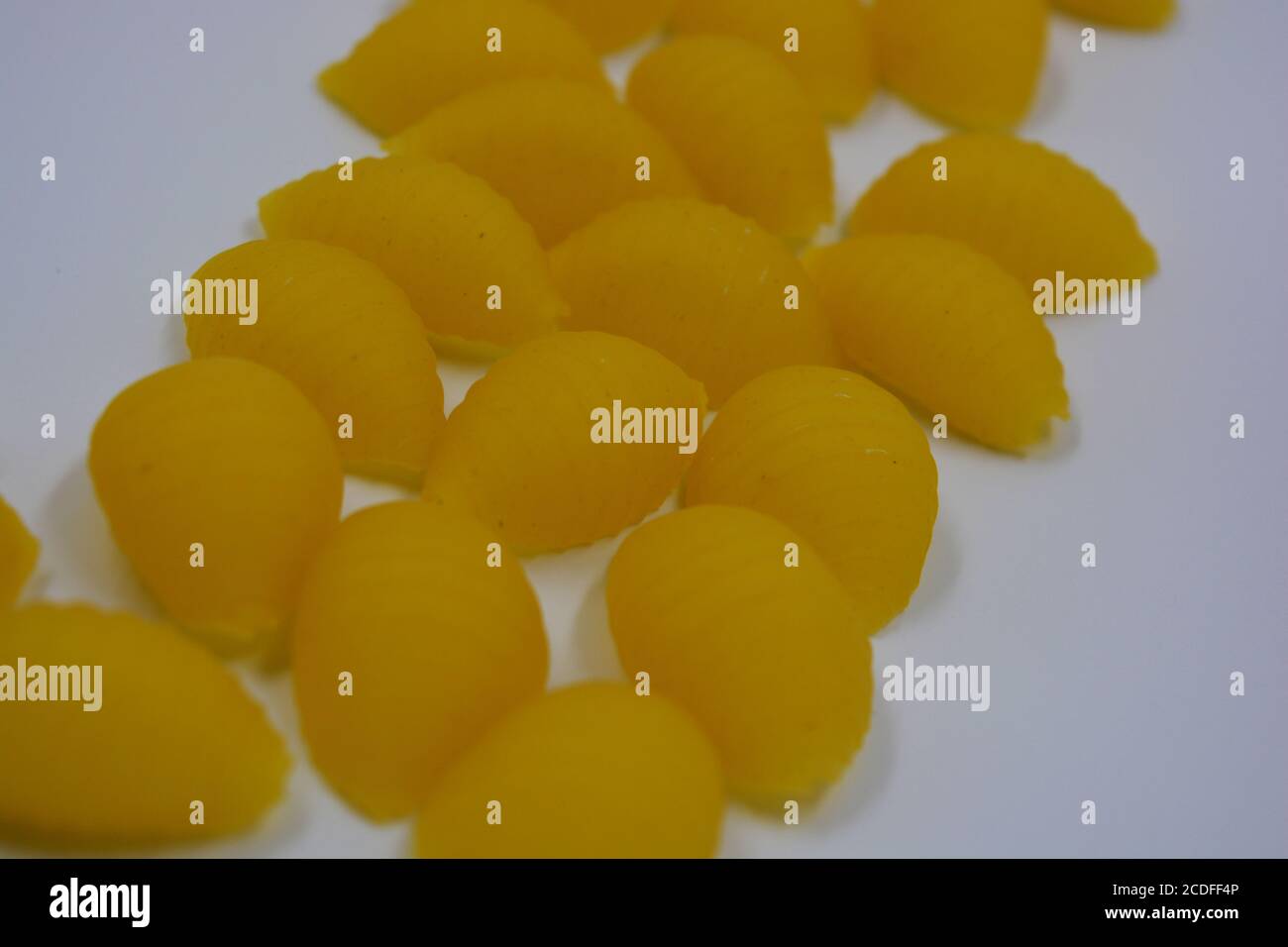 Italian yellow pasta made from durum wheat, vermicelli shells scattered ...