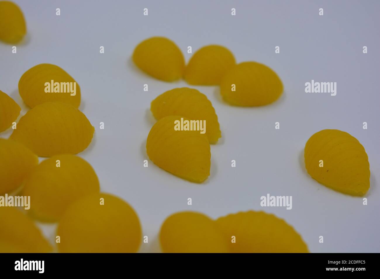 Italian yellow pasta made from durum wheat, vermicelli shells scattered ...