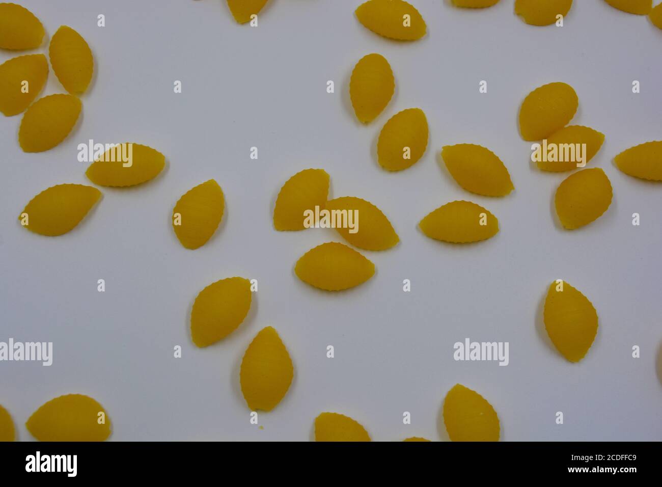 Italian yellow pasta made from durum wheat, vermicelli shells scattered ...