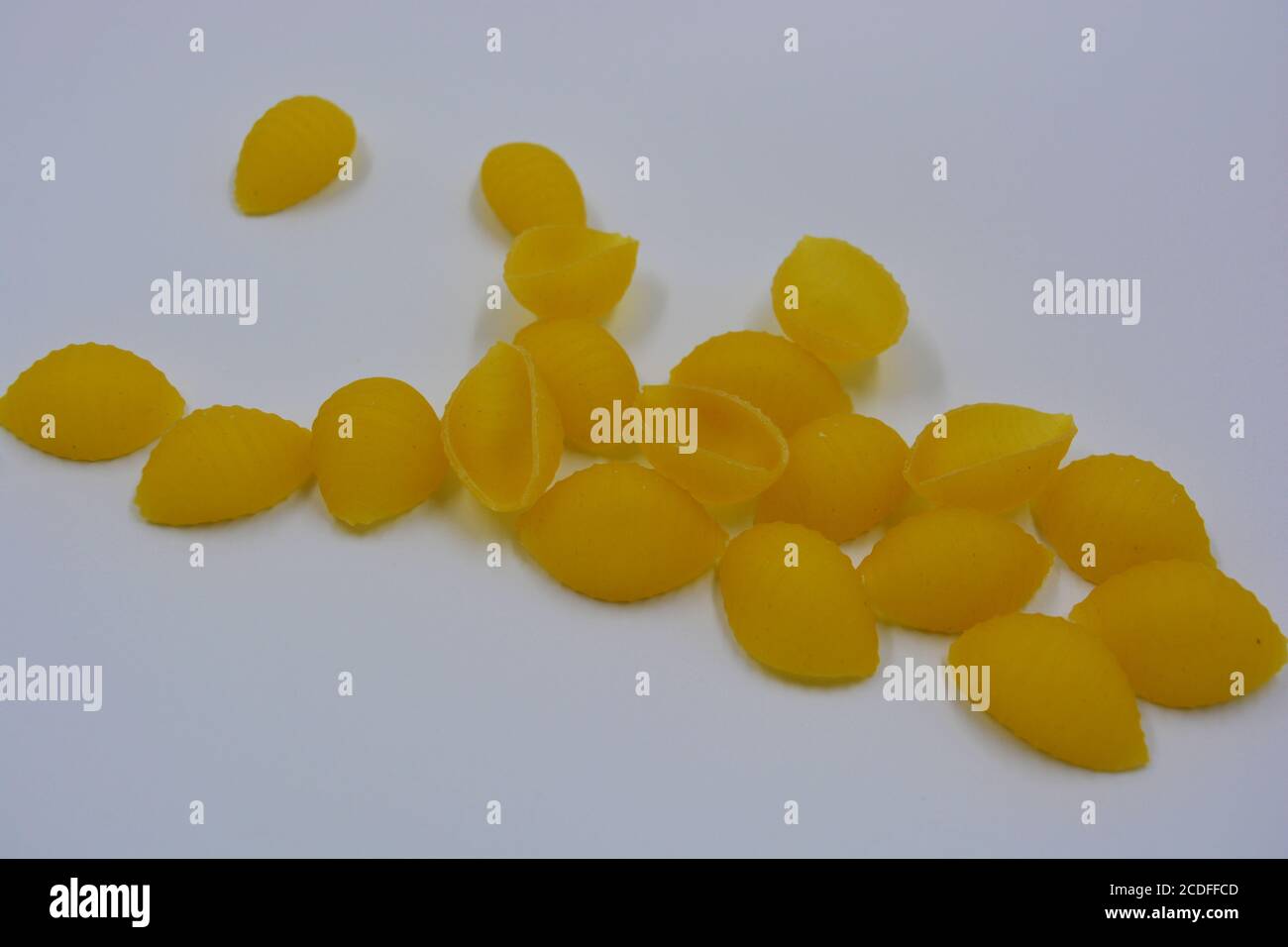 Italian yellow pasta made from durum wheat, vermicelli shells scattered ...