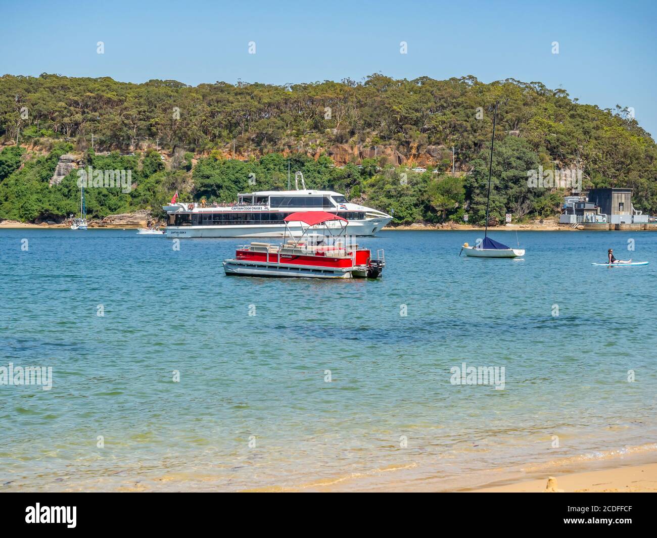 Clontarf Beach on a sunny summer morning with blue sky and blue water ...