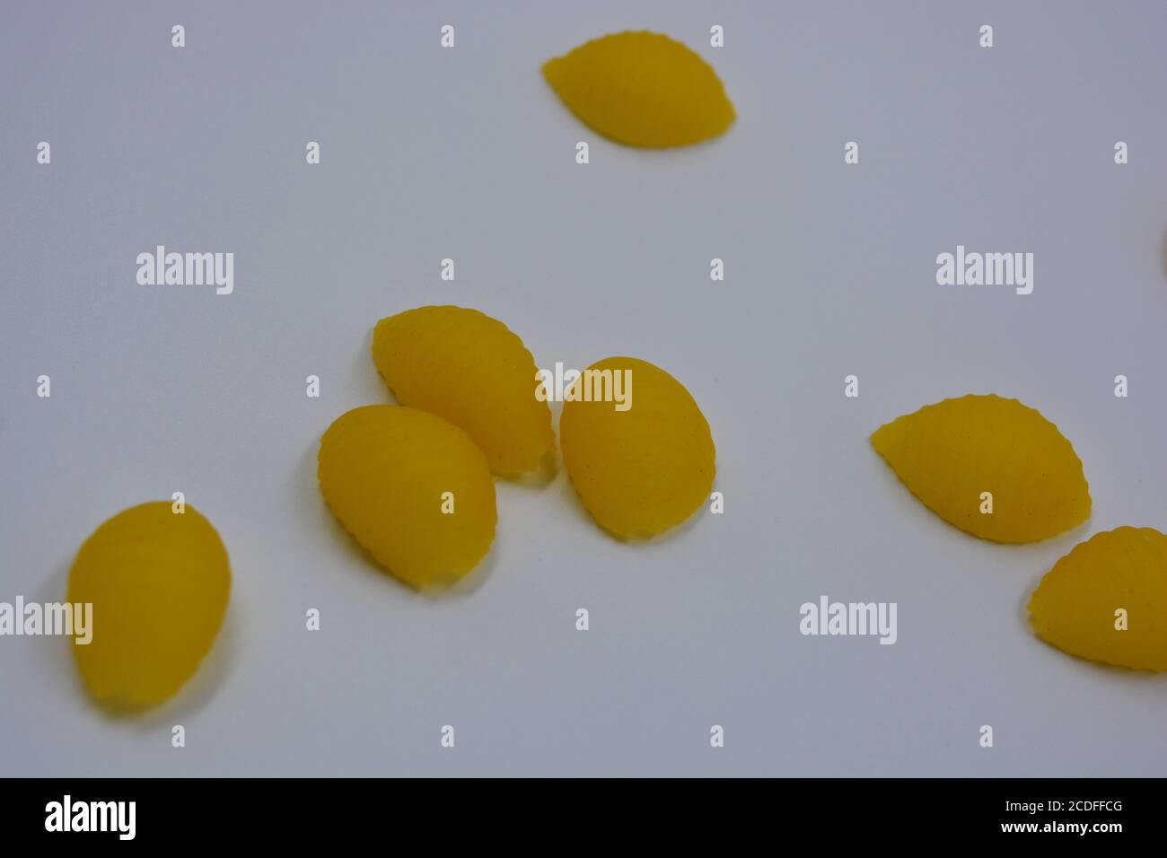 Italian yellow pasta made from durum wheat, vermicelli shells scattered ...